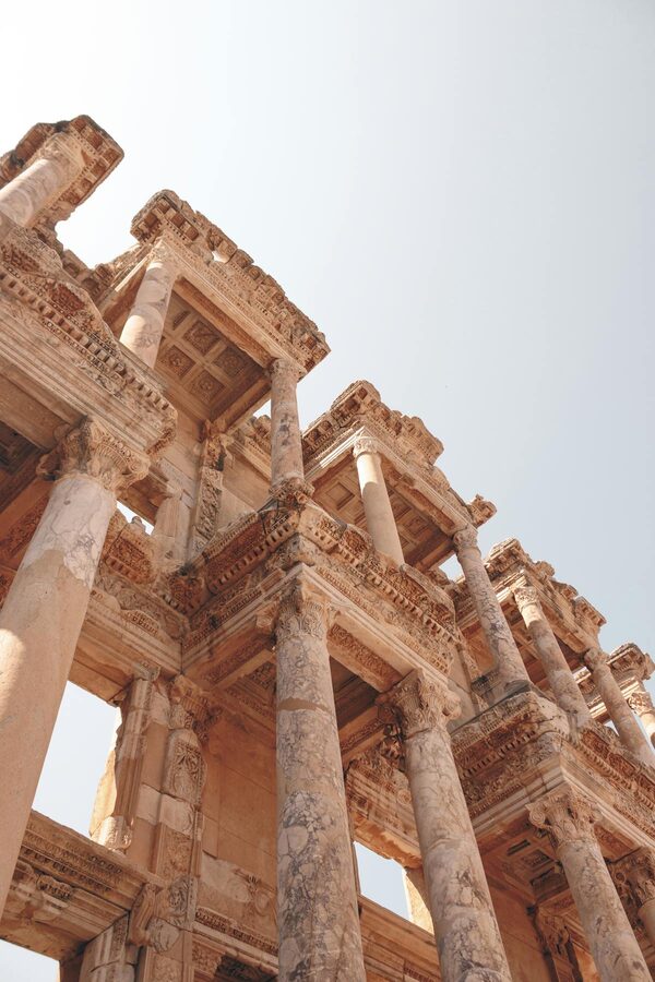 Ancient columns reaching toward a blue sky at the Ephesus archaeological site