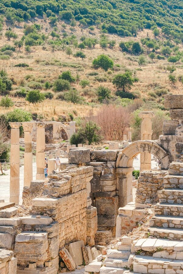 Ancient marble-paved road at Ephesus with ruins on both sides