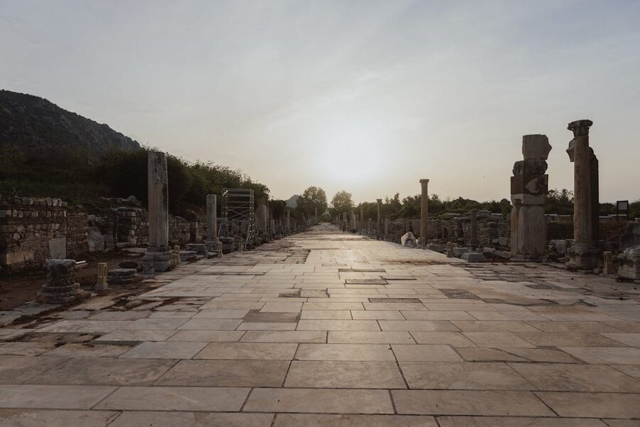 Ephesus ruins glowing in warm golden sunset light