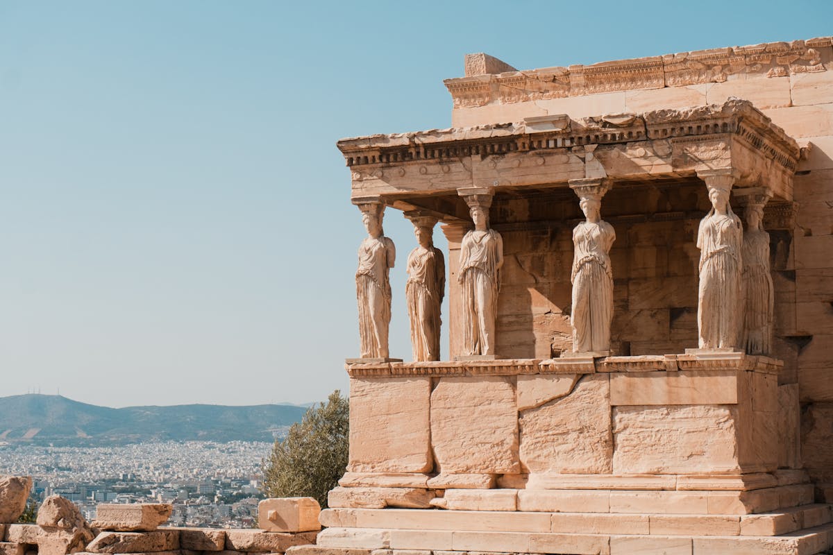 Wide view of the Erechtheion temple with Caryatid statues on the Acropolis