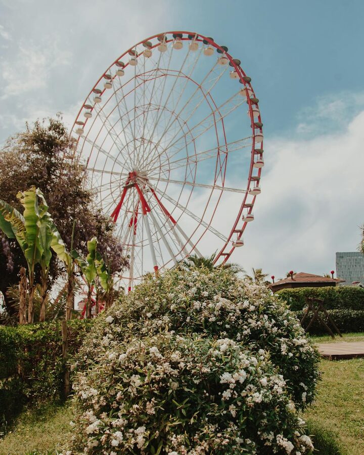 Ferris wheel against blue sky