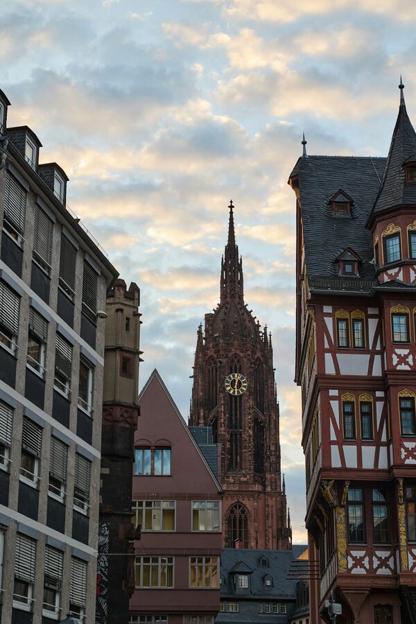 Frankfurt Cathedral with surrounding historic buildings at dusk