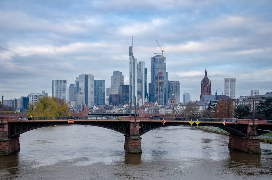 Frankfurt old bridge over Main River with skyline and historic buildings