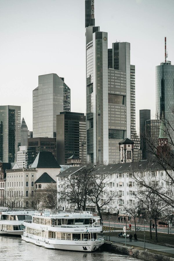 Frankfurt skyline with boats on the Main River and urban skyline behind