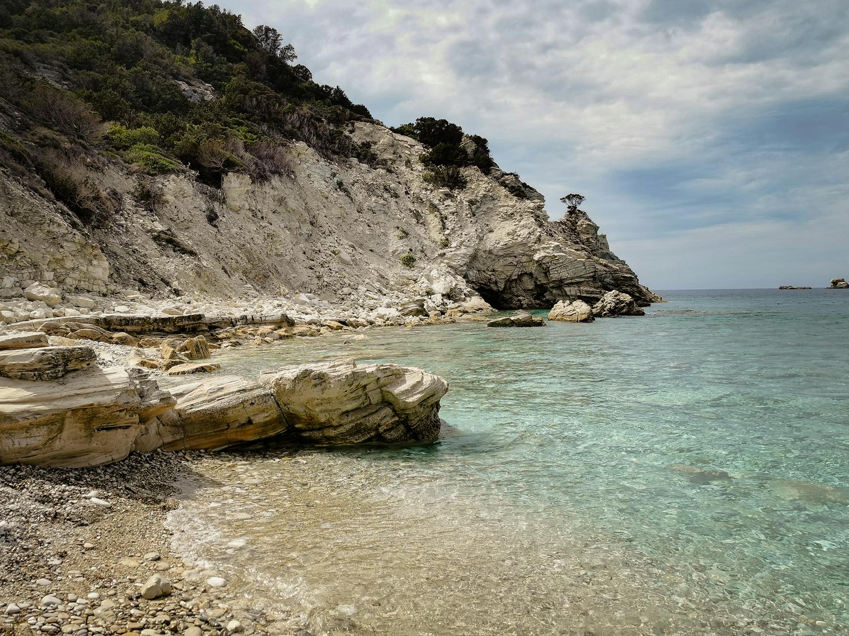 Rocky coastline with clear blue waters at Gaios