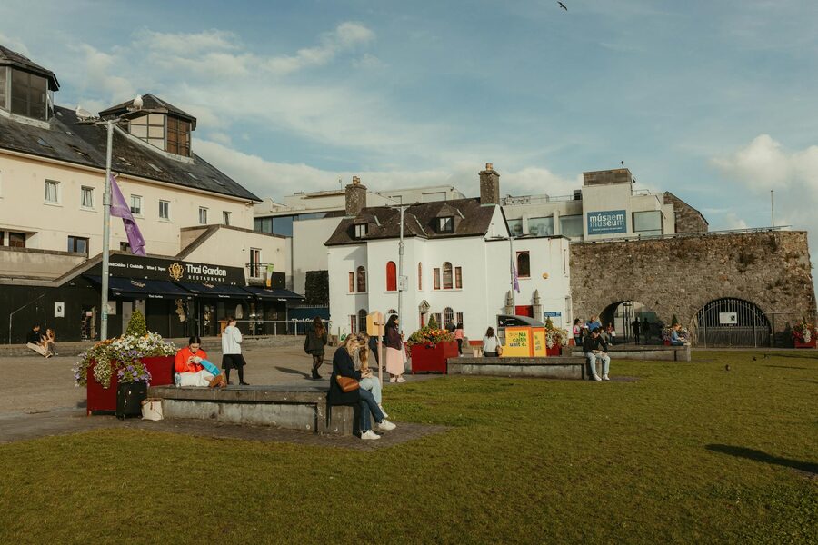 Spanish Arch in Galway with people and historic buildings