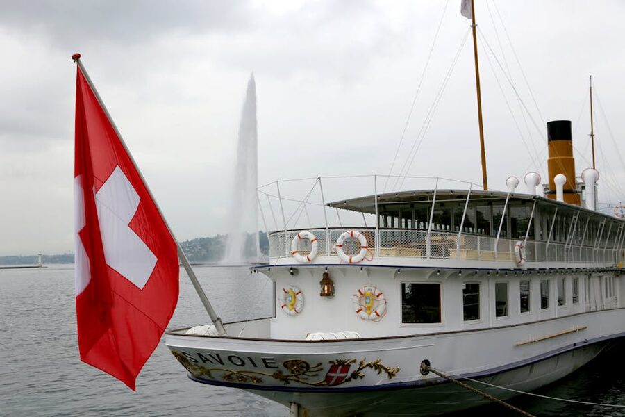 Historic paddle steamer with Swiss flag on Lake Geneva, close-up view