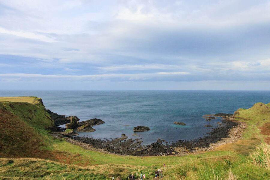 Overview of Giants Causeway basalt formations with coastline and cliffs