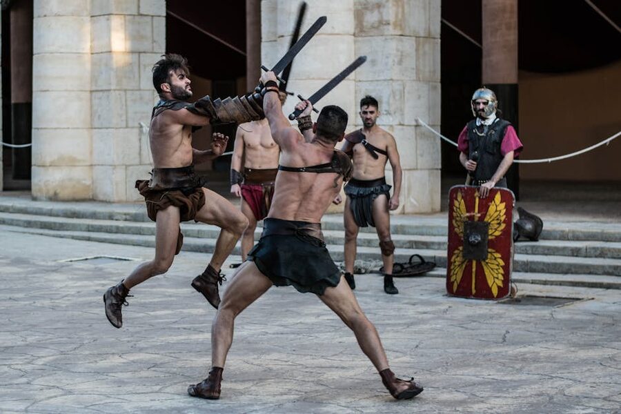 Gladiator combat reenactment with swords and historical armour