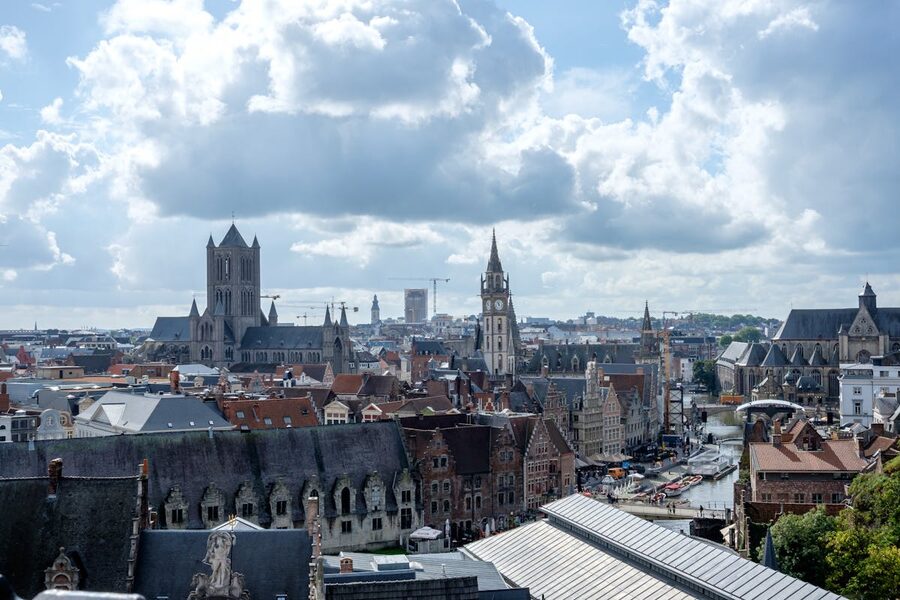Ghent medieval canal with church tower