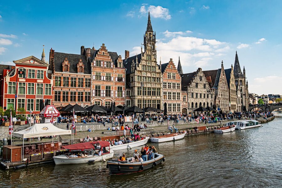 Ghent canal with reflections at sunset