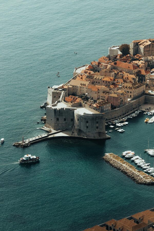 Aerial view of Dubrovnik walled Old Town and harbour