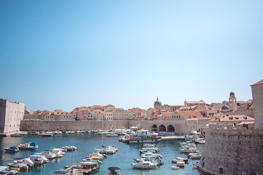 Historic harbour in Dubrovnik with boats and medieval architecture