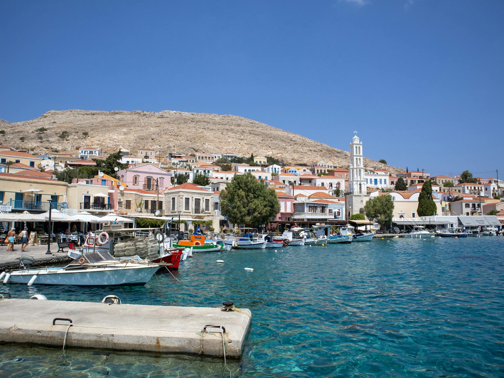 Colorful Greek harbor town with traditional buildings