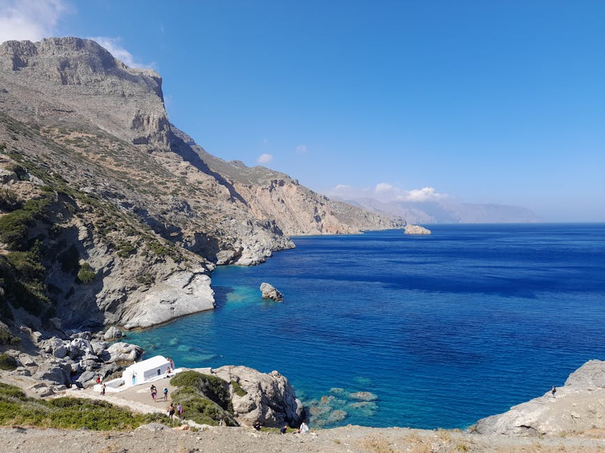 Traditional Greek island boat at anchor in a quiet bay