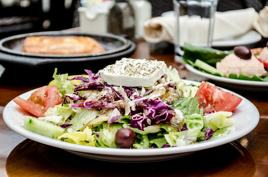 Traditional Greek salad with feta cheese tomato and olives