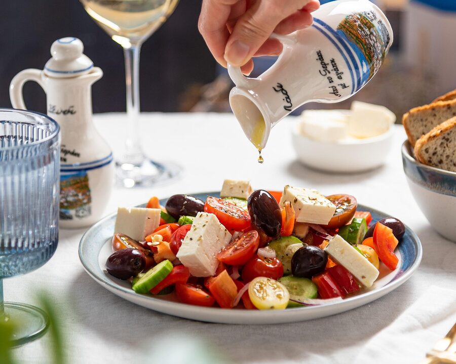 Greek tavern food dishes spread on a table