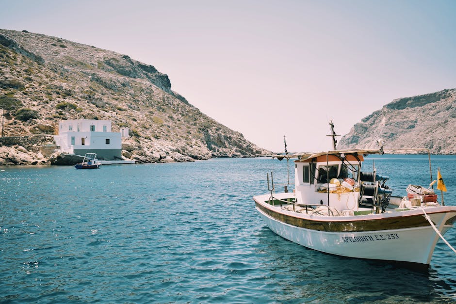 Traditional Greek kaiki wooden boat moored at a harbor