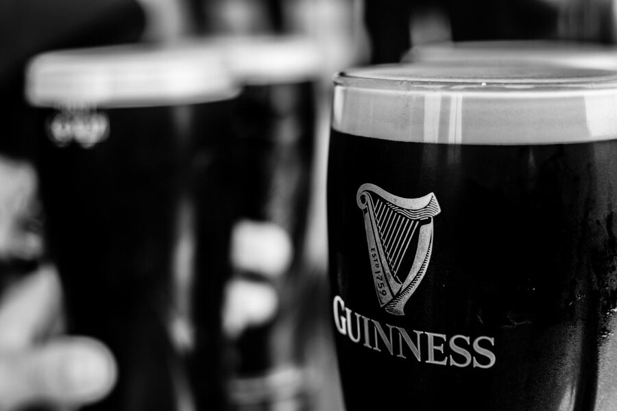 Two pints of Guinness in an Irish pub in black and white