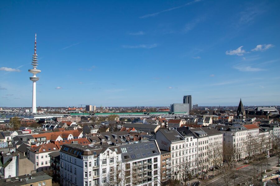Aerial view of Hamburg skyline featuring the TV tower under clear blue sky