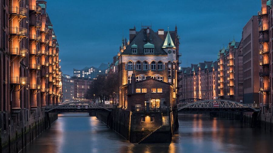 Illuminated Speicherstadt warehouse district in Hamburg at dusk