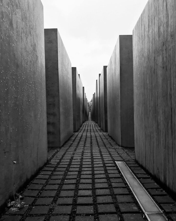 Black and white image of concrete blocks at the Holocaust Memorial in Berlin seen in perspective
