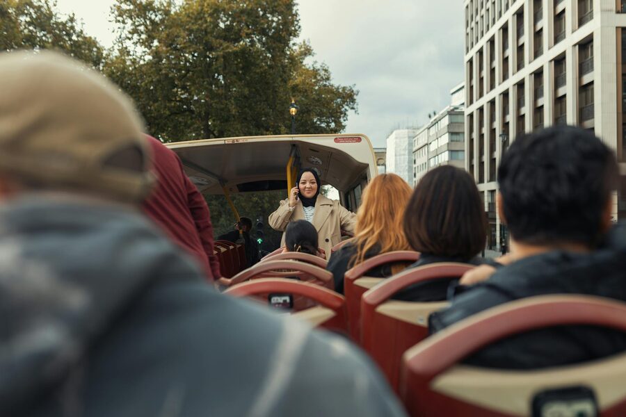 Group on city tour open-top bus