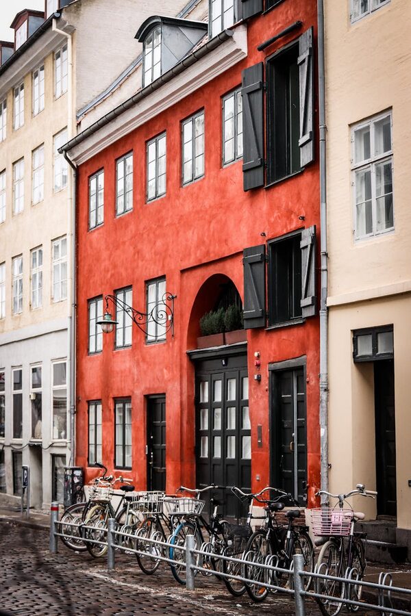 Bicycles parked along a colorful Copenhagen street