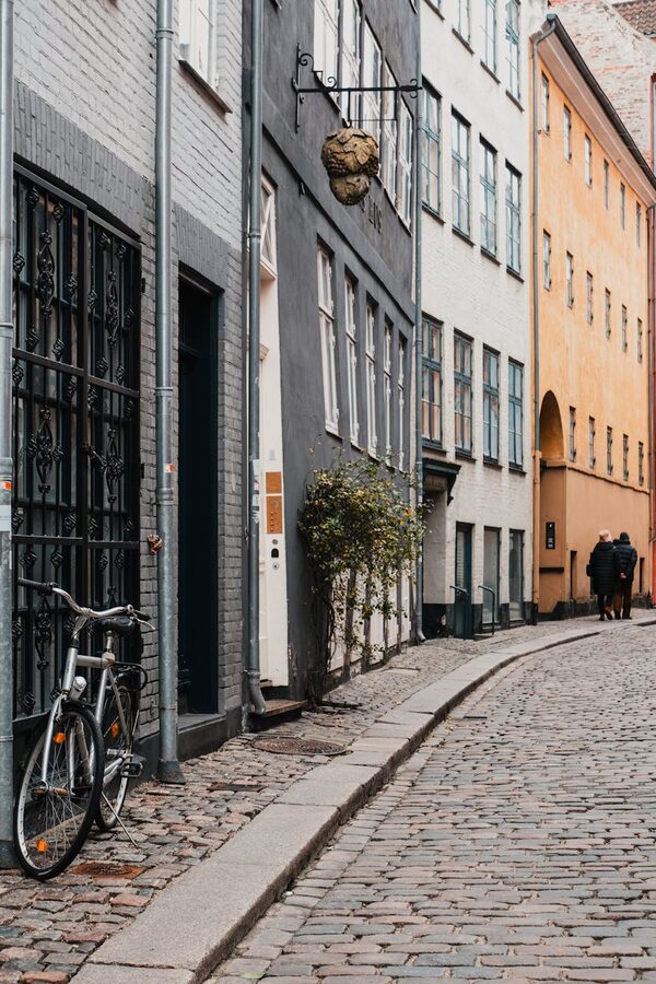 Cobblestone street with bicycles and historic buildings in Copenhagen