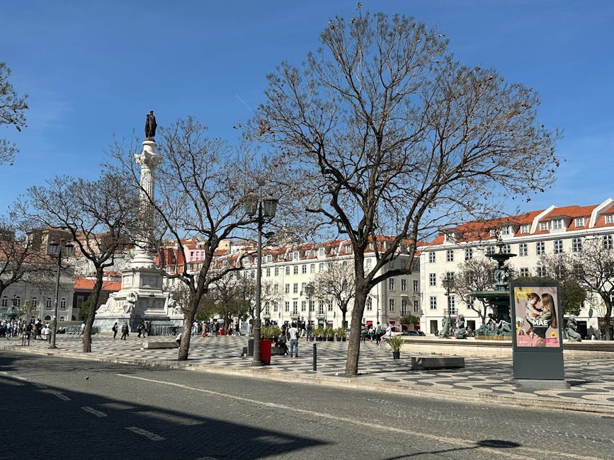 Rossio Square statue column sunny Lisbon