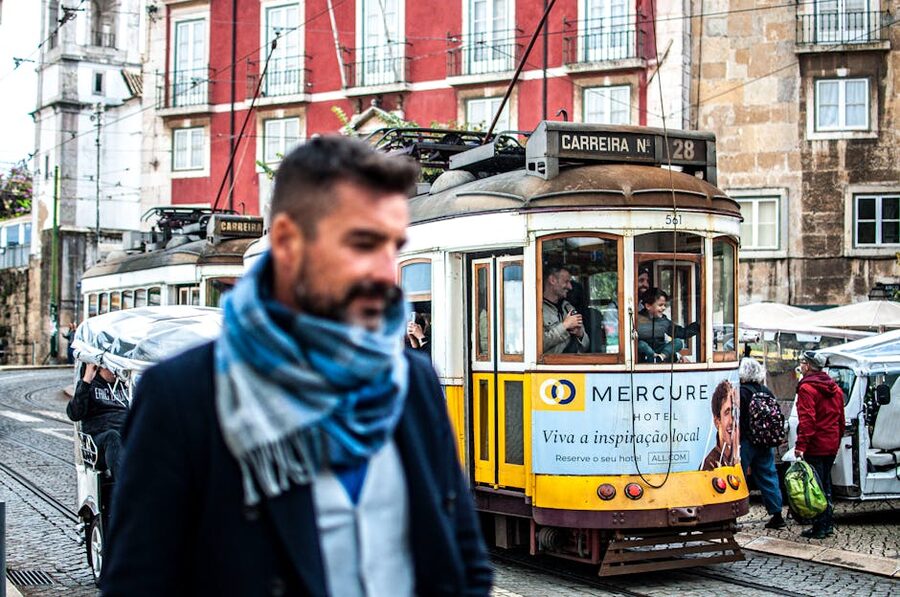 Lisbon tram passing on a central street