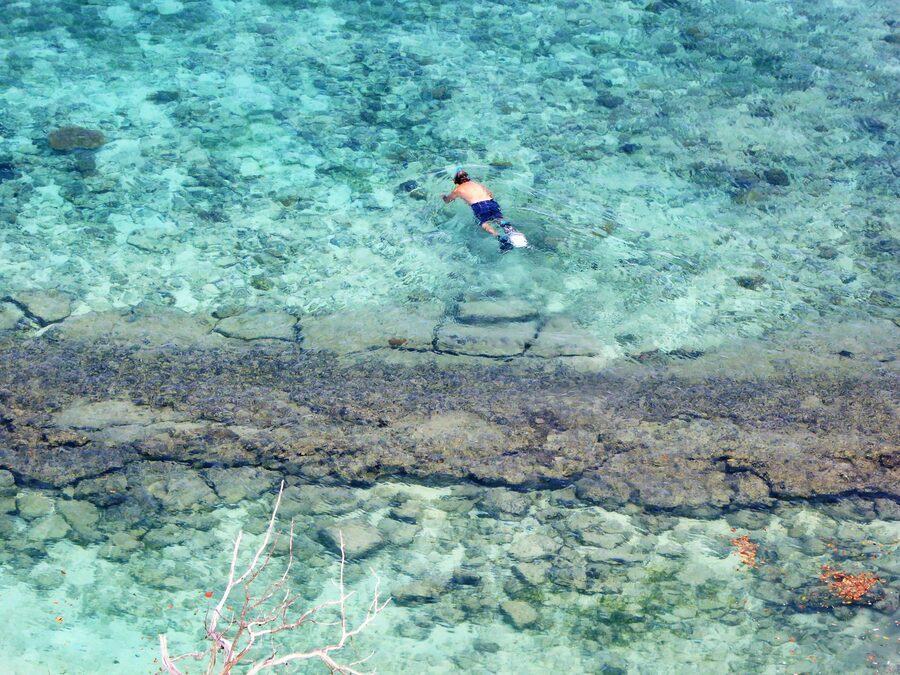 Snorkeler in crystal clear waters