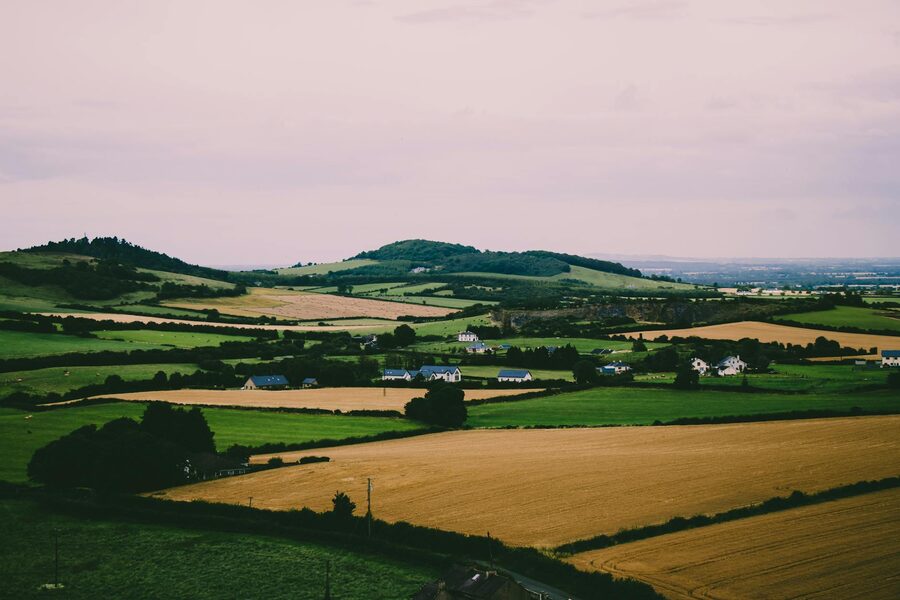 Rolling green fields and hills in the Irish countryside