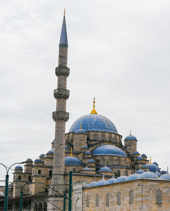 Blue Mosque with its towering minaret against a clear sky in Istanbul