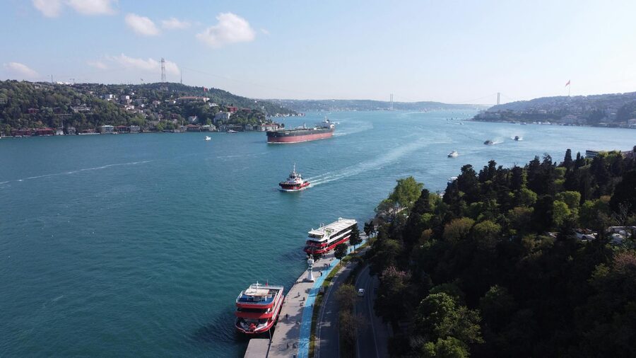 Aerial view of the Bosphorus in Istanbul with boats and the iconic bridge on a sunny day
