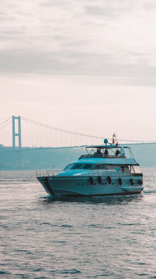 Luxury yacht approaching the Bosphorus Bridge in Istanbul