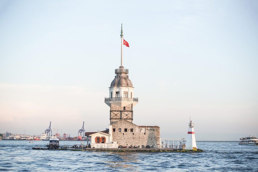 Maiden's Tower in Istanbul at sunset with ferry passing