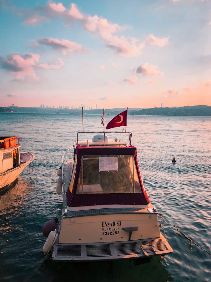 Motorboat with Turkish flag at sunset on the Bosphorus