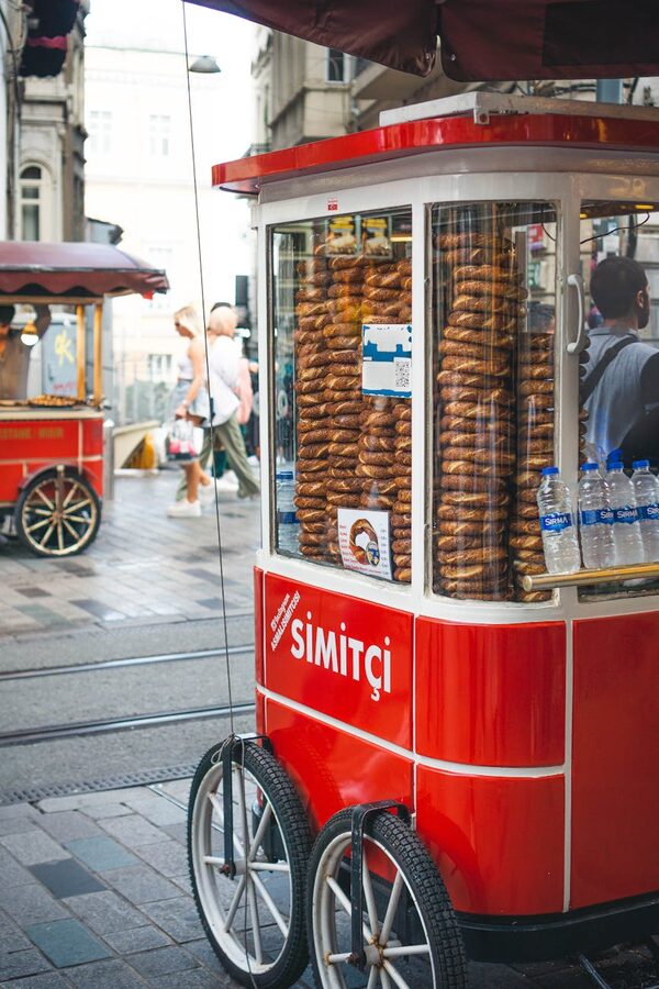 Traditional Turkish simit bread cart on a busy Istanbul street