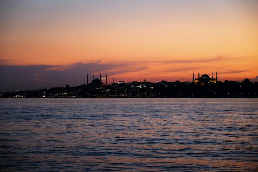 Istanbul skyline over water at twilight with mosques in view