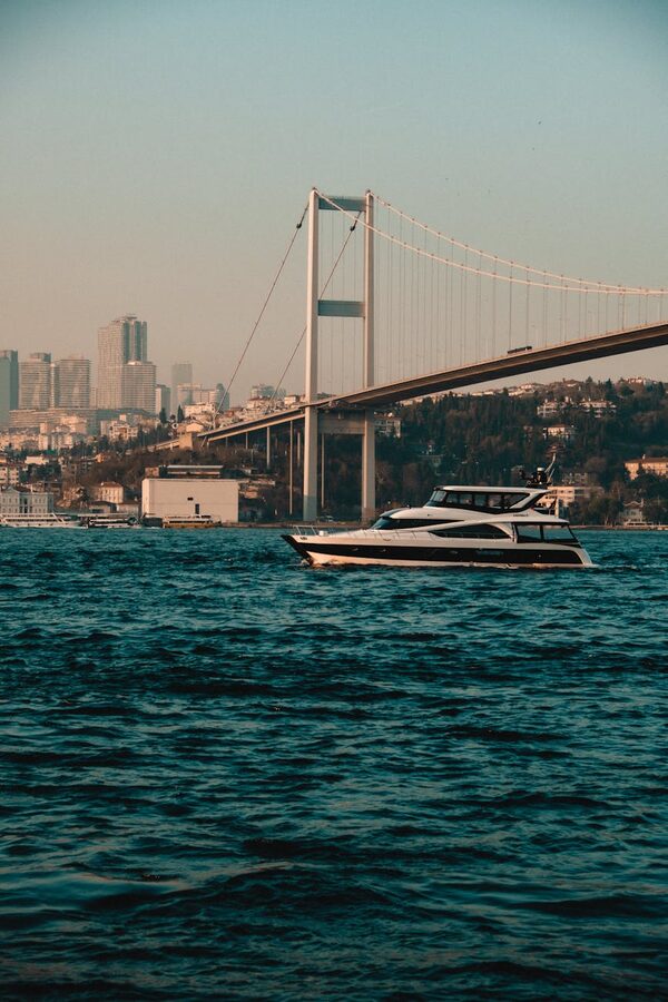 Yacht passing under the Bosphorus Bridge