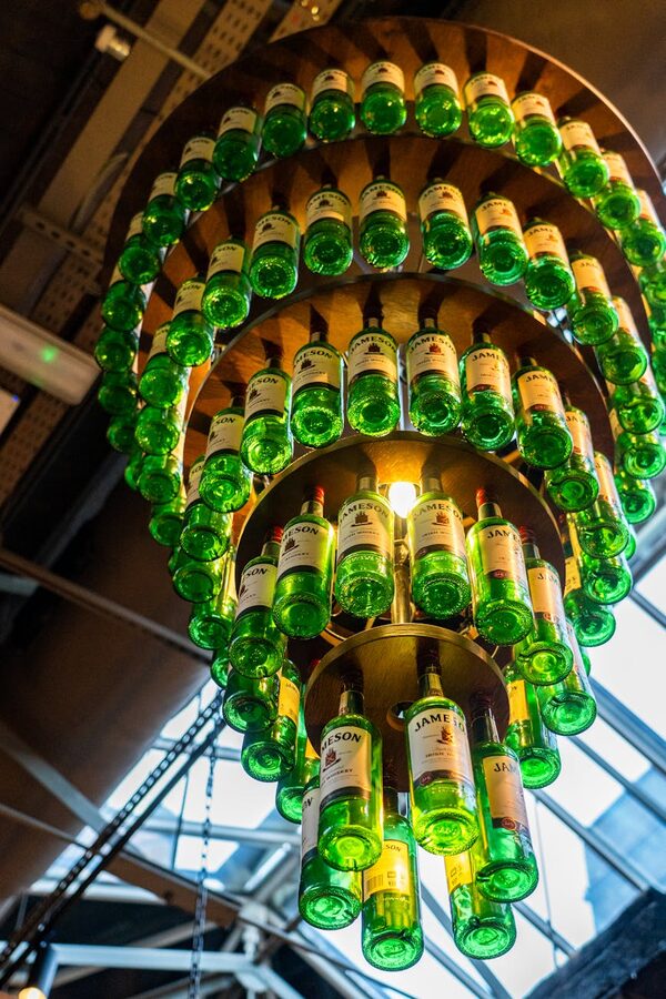 Chandelier made of green Jameson whiskey bottles in an Irish setting
