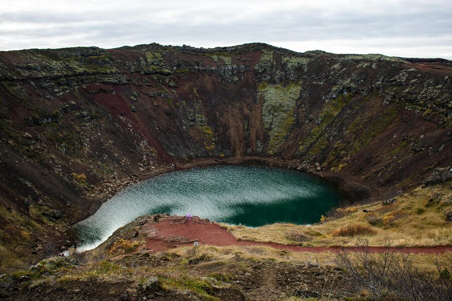 Kerid volcanic crater lake with green slopes and turquoise water in Iceland