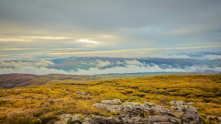 Misty mountains and green valleys in County Kerry at dawn