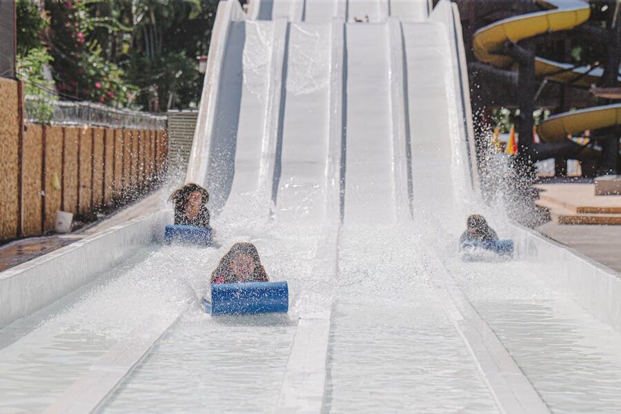 Children having fun on a water slide at a park