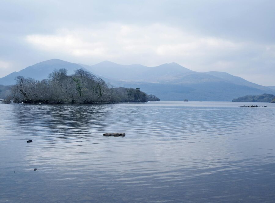 Lake and mountain scene in Killarney National Park under cloudy skies