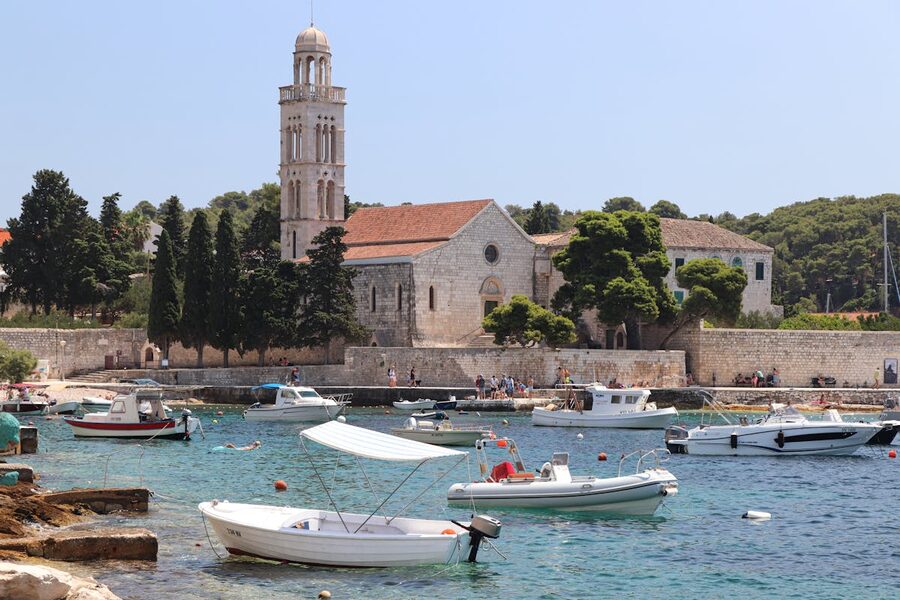Coastal town with church and moored boats