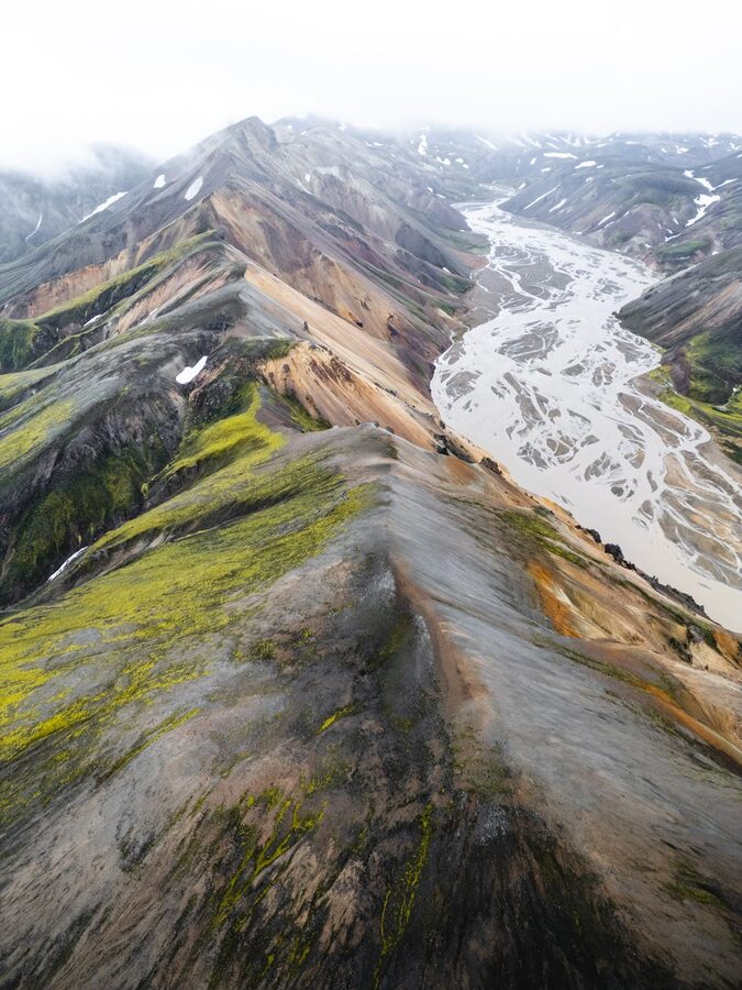 Aerial view of river winding through colorful Landmannalaugar mountains