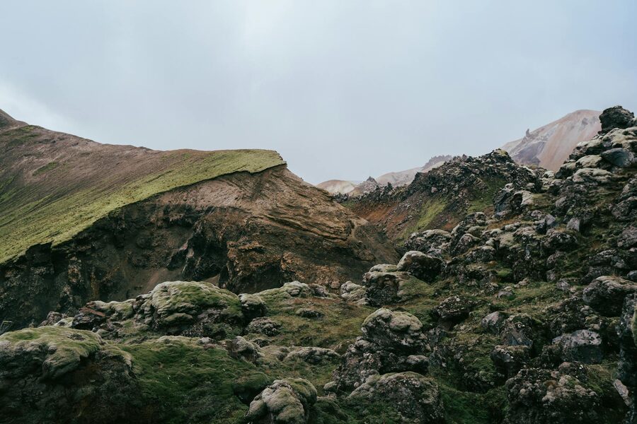 Rocky volcanic terrain with colorful mountains in Landmannalaugar Iceland