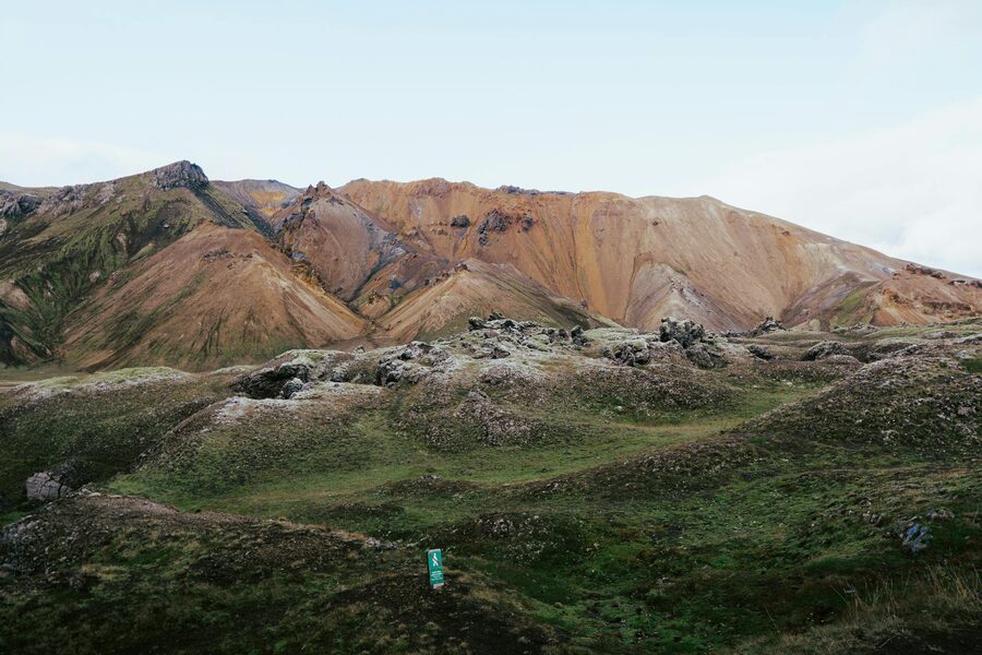 Volcanic peaks with mineral deposits creating bands of color in Landmannalaugar